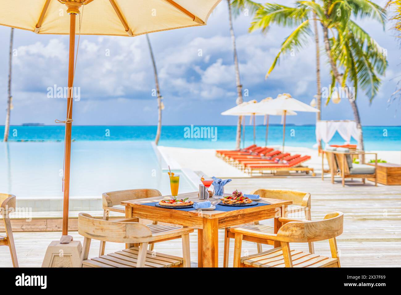 Luxury resort hotel poolside, outdoor restaurant on beach, ocean sky ...