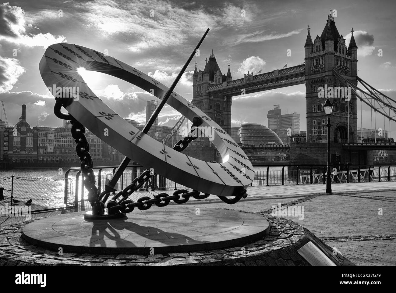 Black and White image of a Sun dial along the Thames river in London ...