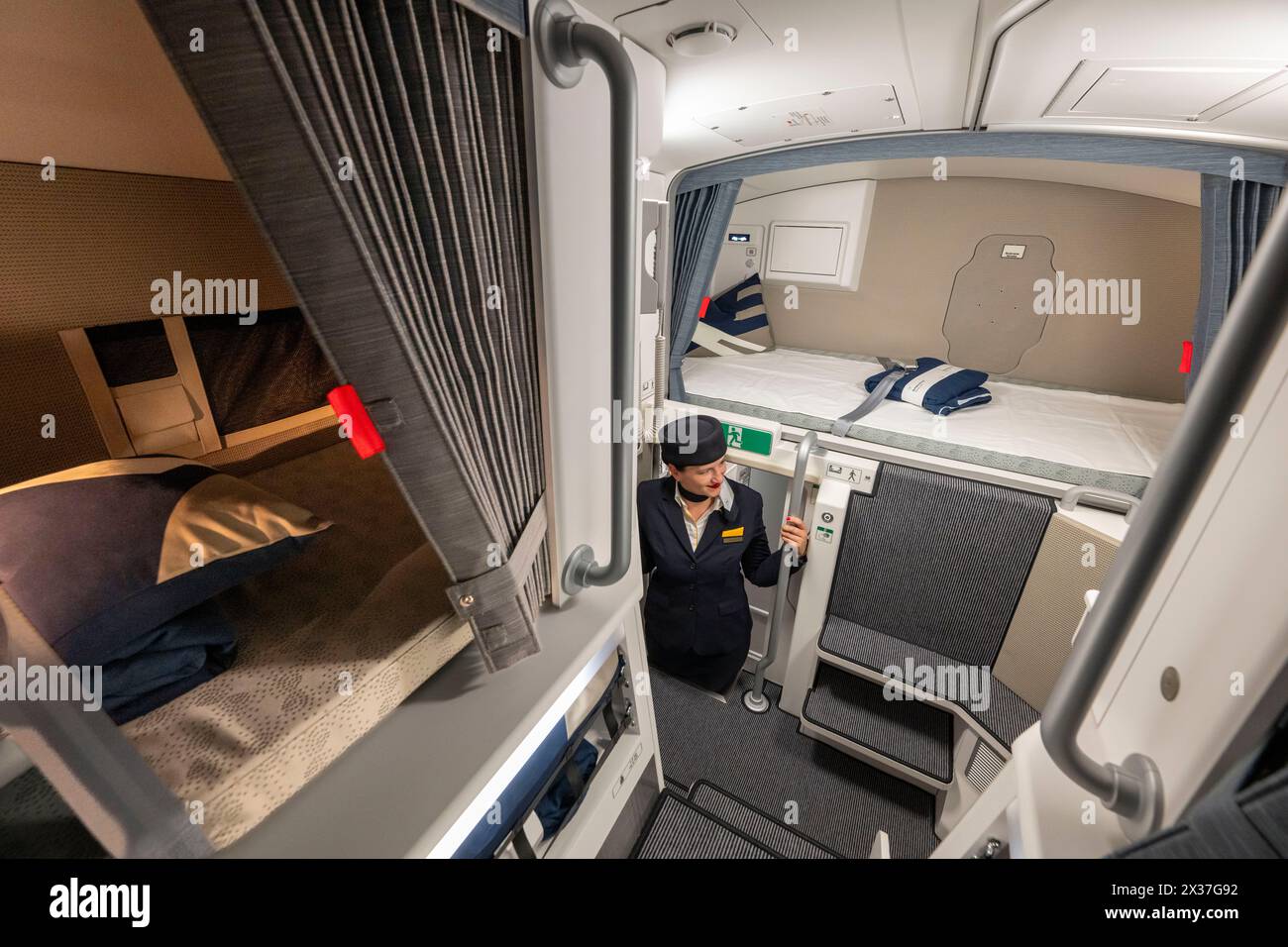 Munich, Germany. 25th Apr, 2024. A Lufthansa cabin crew member stands ...