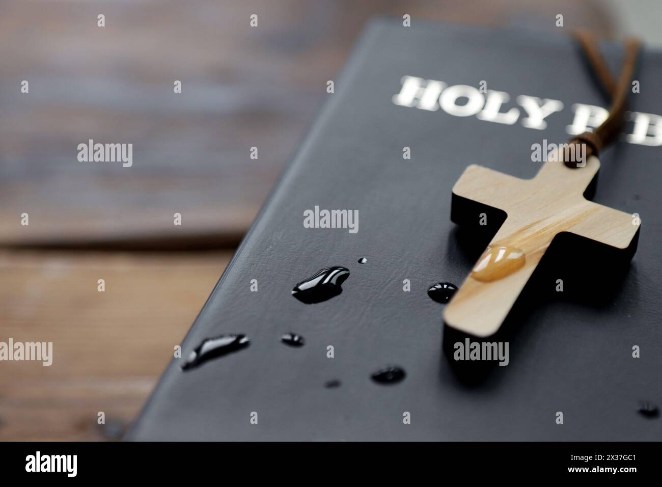 The holy Bible, the cross of Jesus, and the tears of sadness and ...