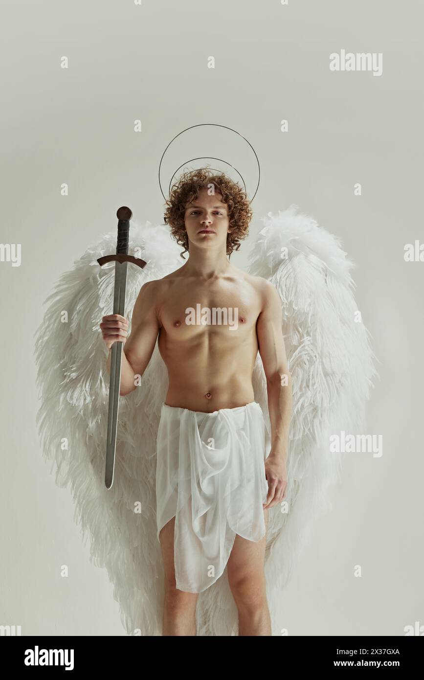 Man with curly hair looks like angel with wings and halo above head ...