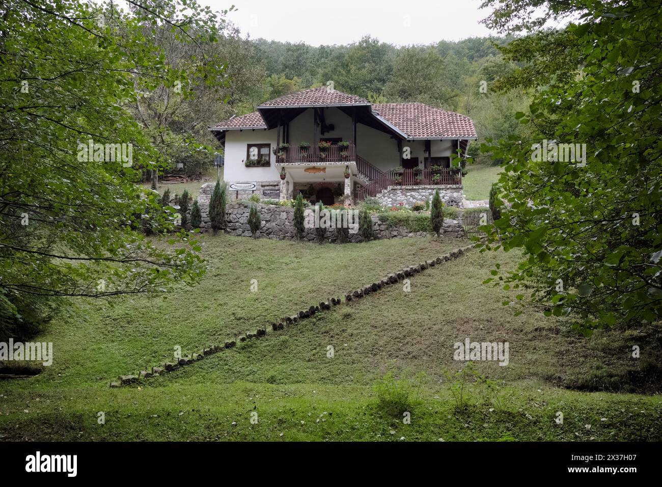 serbian Carpathians mountain lodge along the footpath to the spring of ...