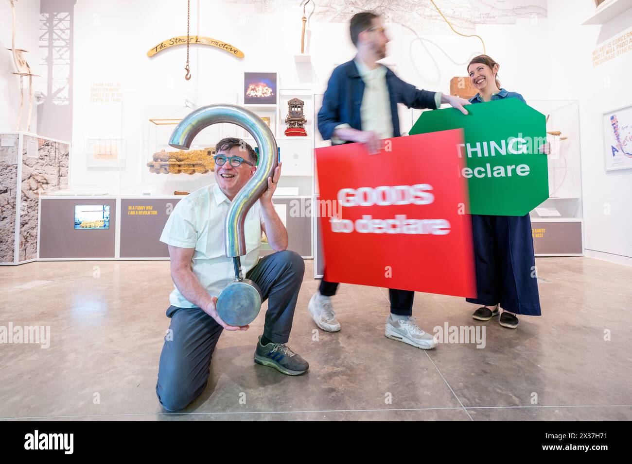 Gallery designer Andy McGregor (left) with 'Question Mark (2005)' and ...