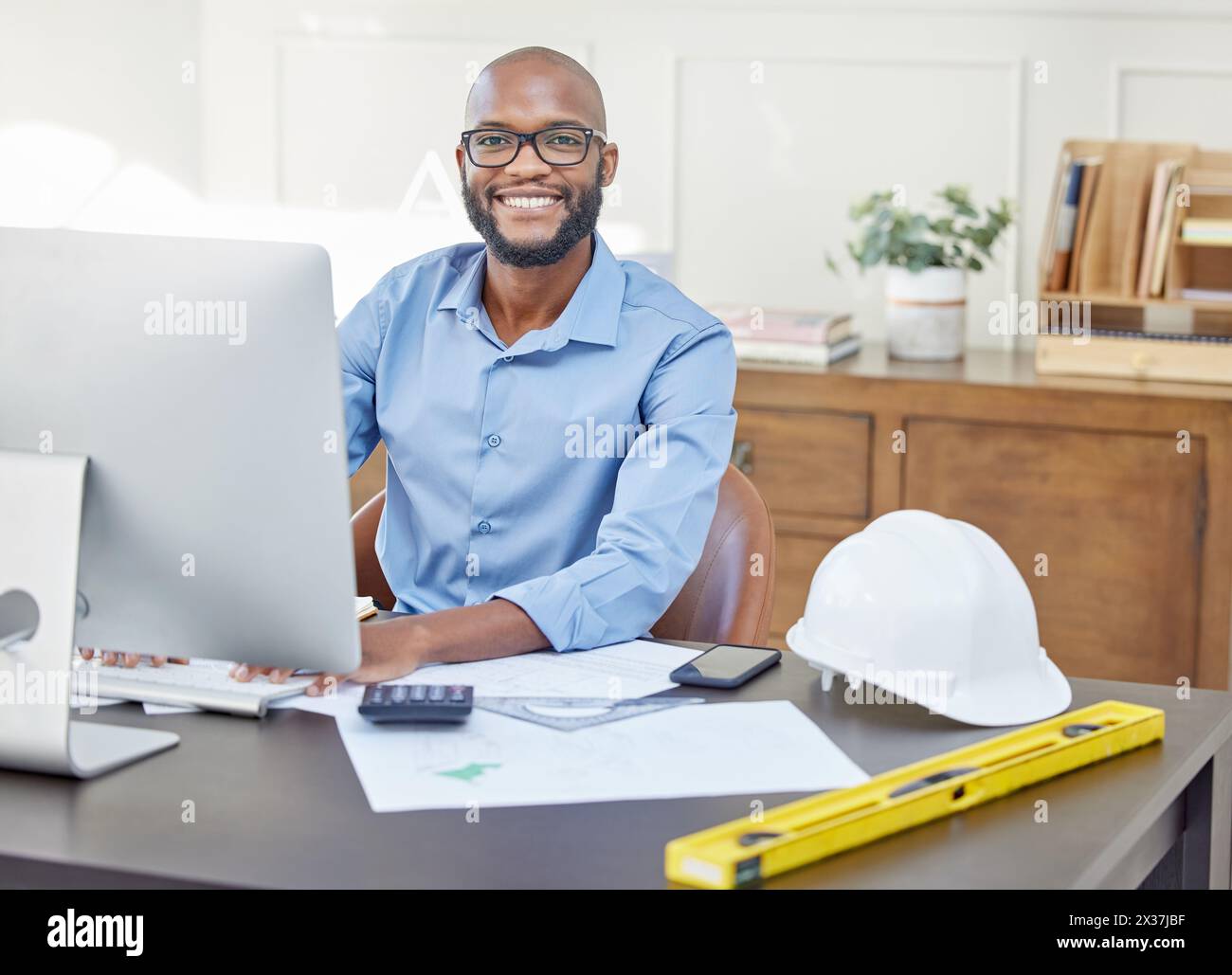 Portrait, engineer or architect black man with computer at desk for ...
