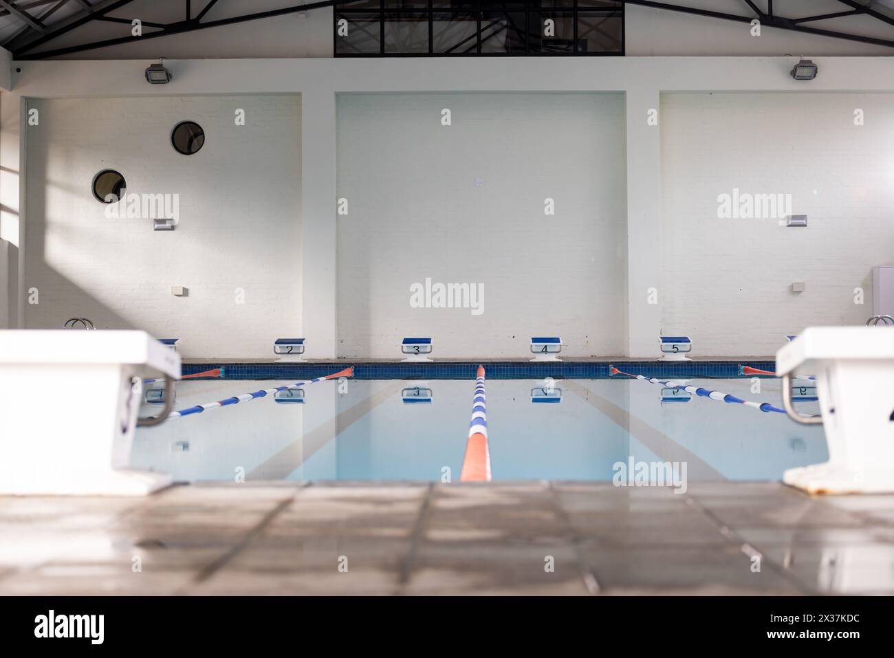 Swimmers are not visible, only an empty indoor pool awaits indoors ...