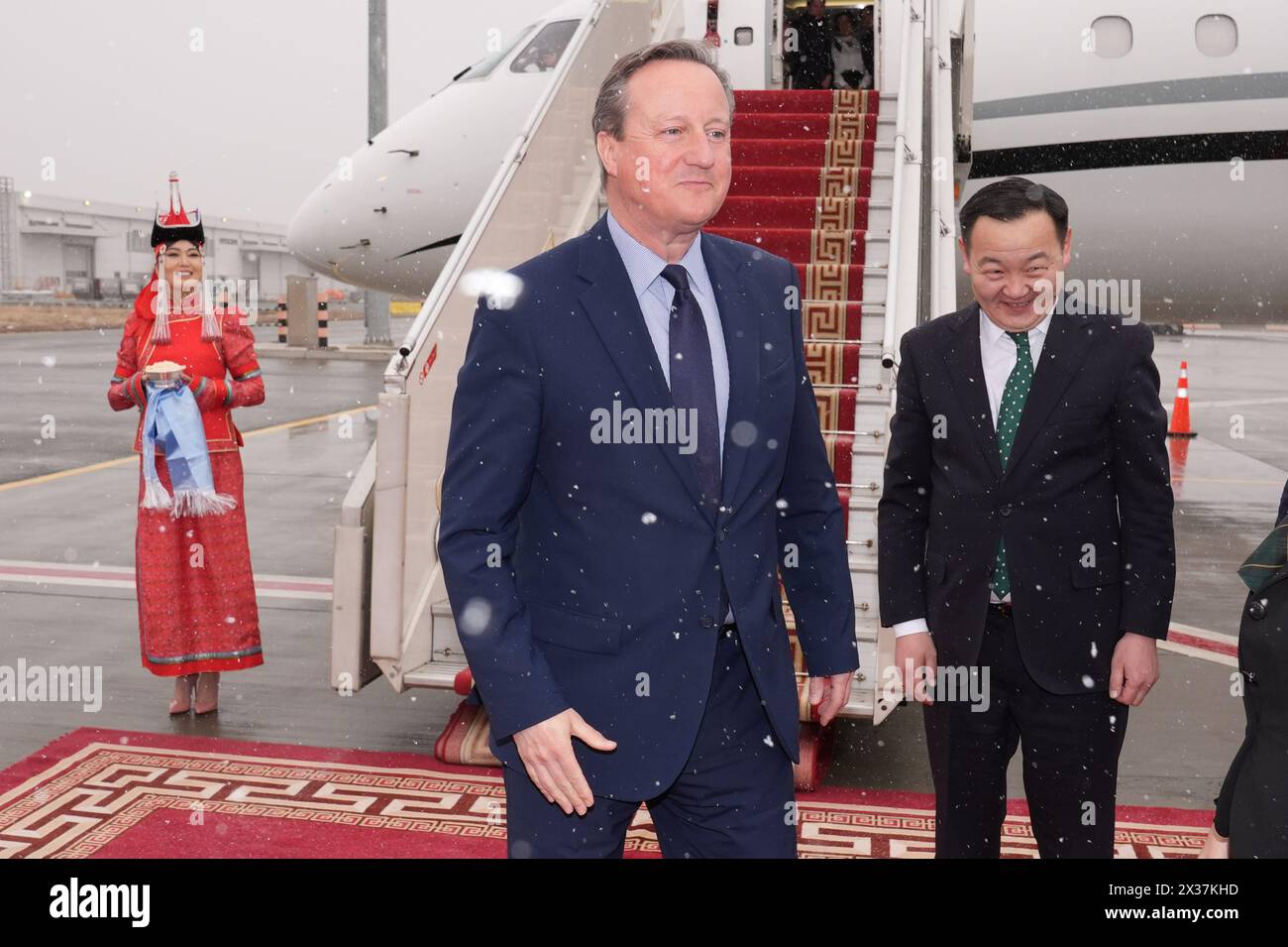 Foreign Secretary Lord David Cameron arrives in the snow at Chinggis ...