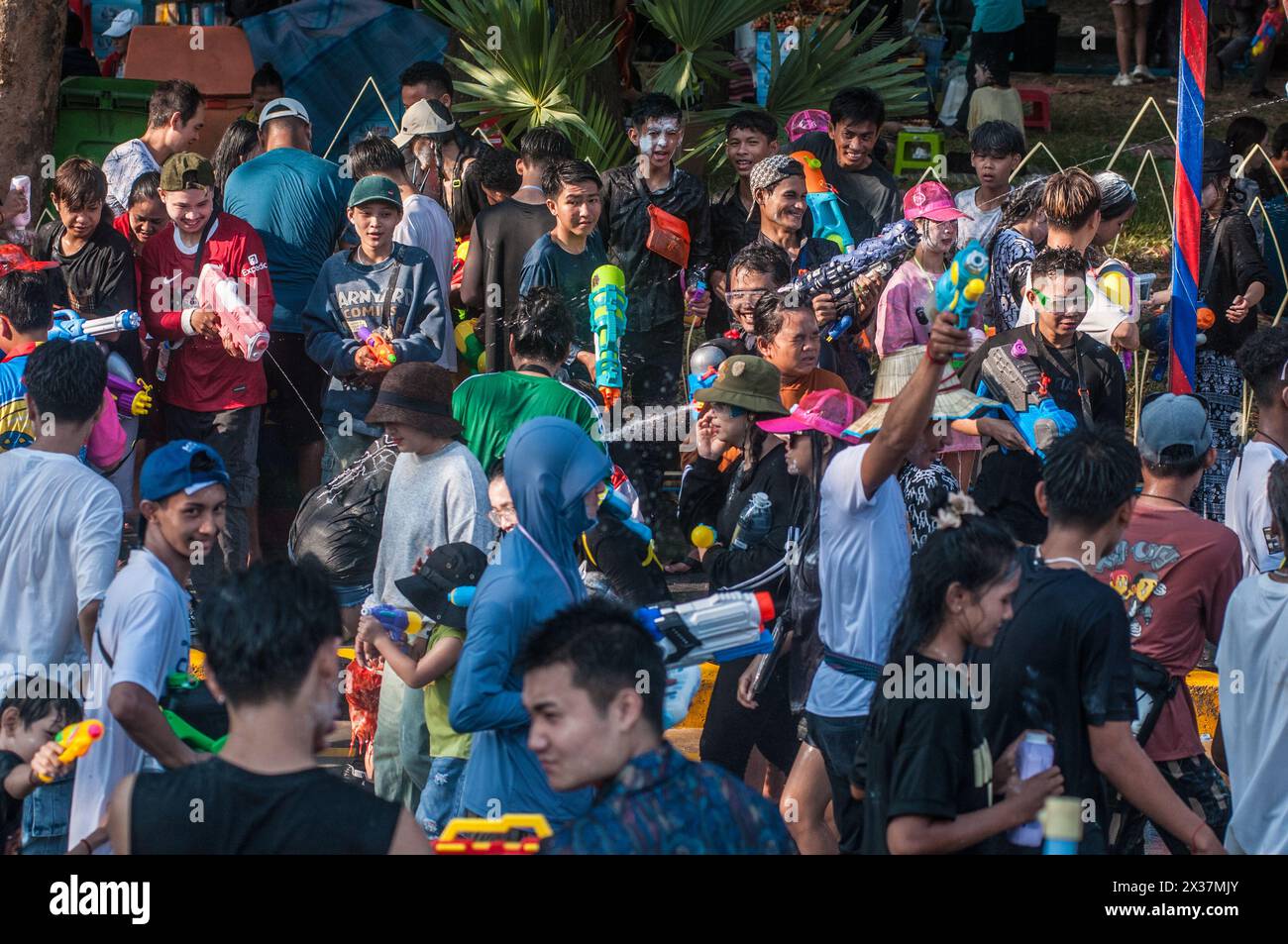 A water gun battle during The Cambodian New Year festival. Wat Phnom ...
