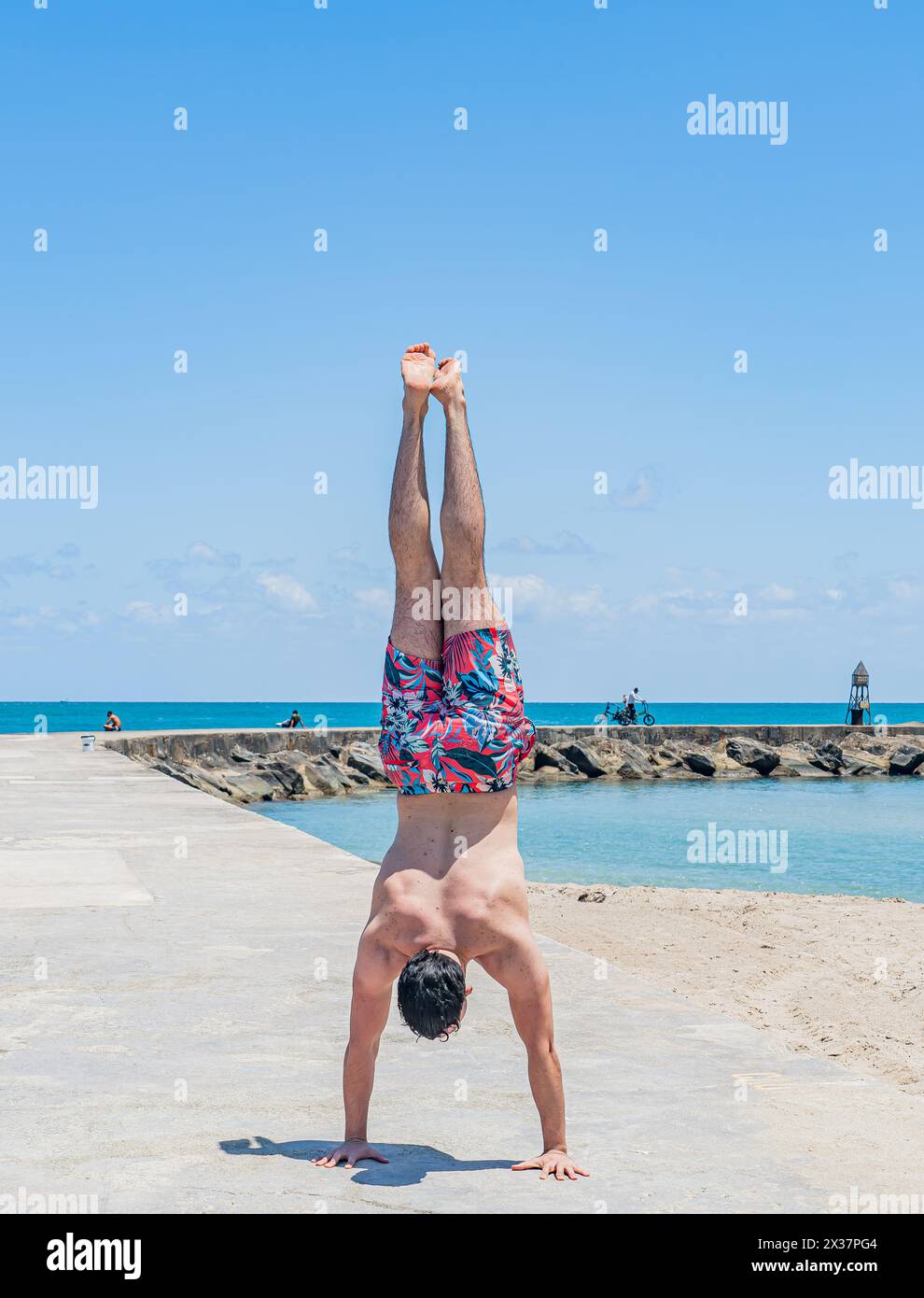 Bal Harbour Beach, Miami , Florida - Young man exercises at the beach ...