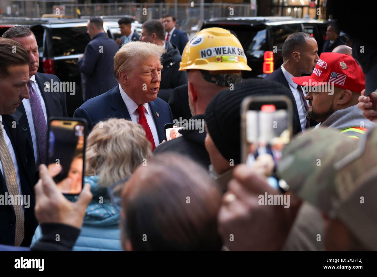 Former President Donald Trump speaks with construction workers at the ...