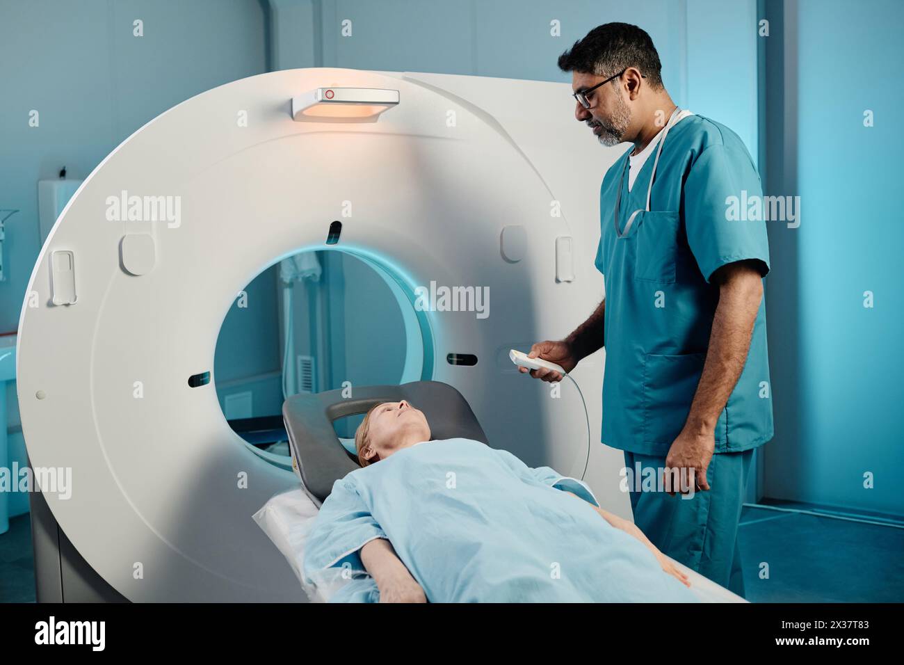 Mature Caucasian woman having CT scan procedure in modern clinic ...