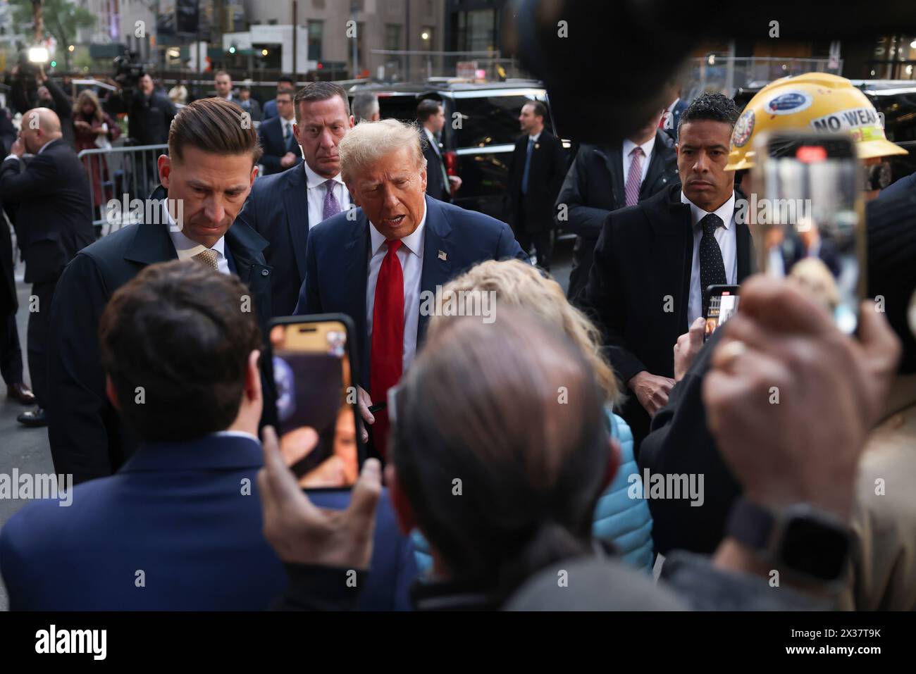Former President Donald Trump speaks with construction workers at the ...
