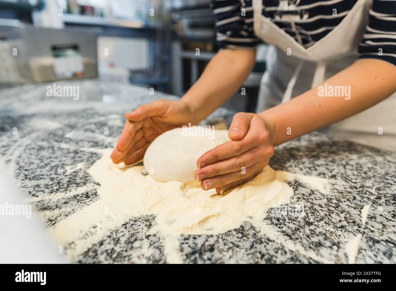 shaping the dough in pizza dough balls in the kitchen, pre pizza making ...
