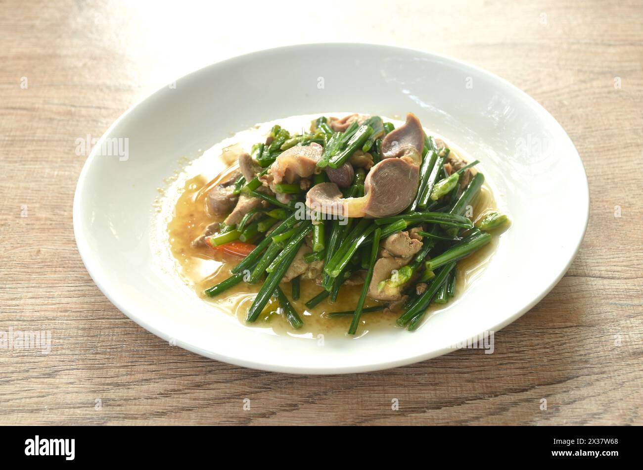 stir fried garlic chives with chicken organ on plate Stock Photo - Alamy