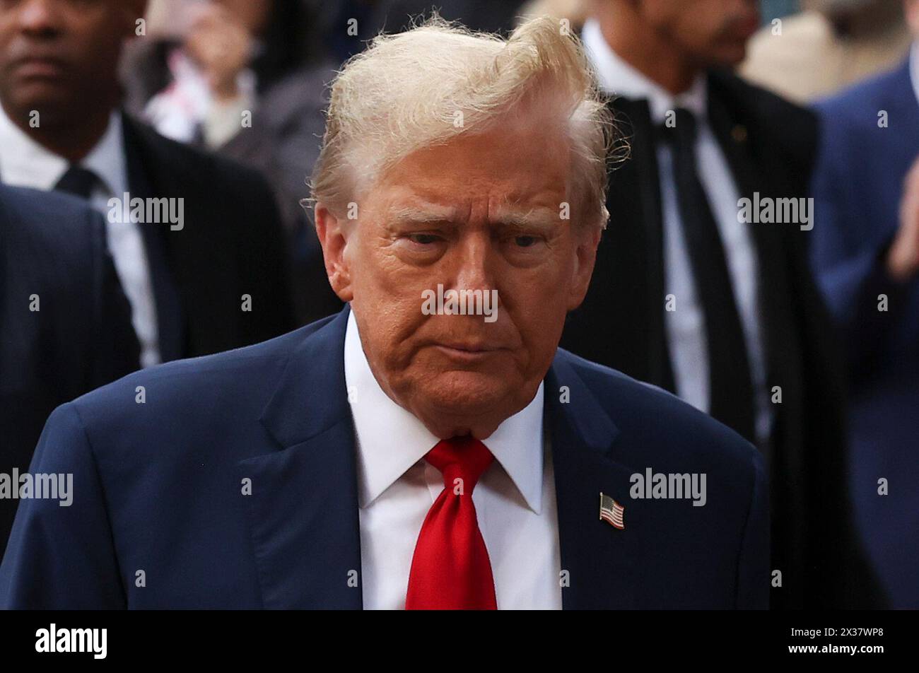 Former President Donald Trump makes his way to a group of construction ...
