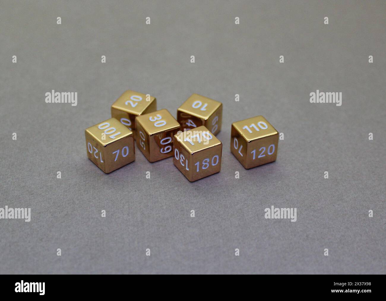 Golden dice with numbers. Game dice Stock Photo - Alamy