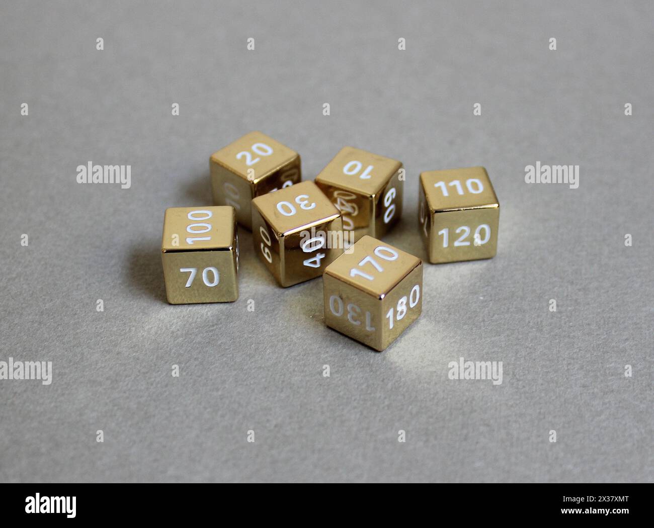 Golden dice with numbers. Game dice Stock Photo - Alamy
