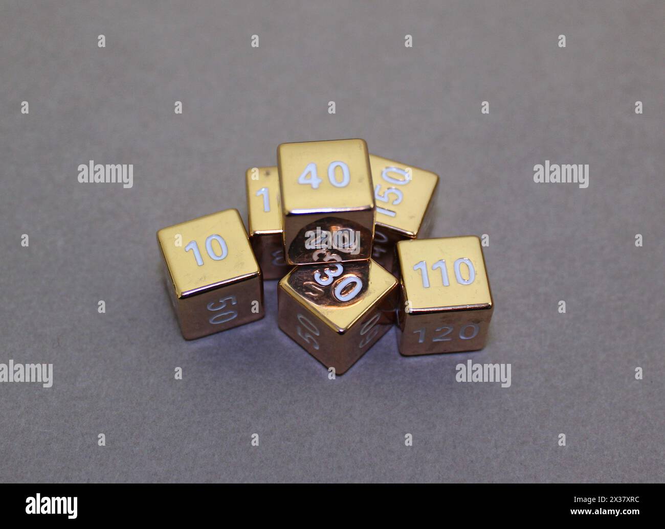 Golden dice with numbers. Game dice Stock Photo - Alamy