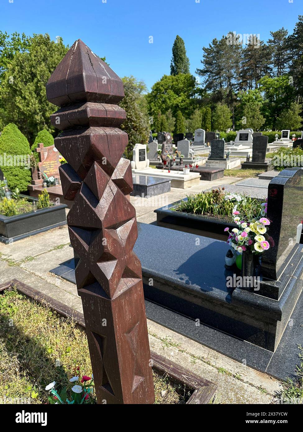 Wooden tombstone in the public cemetery Stock Photo - Alamy