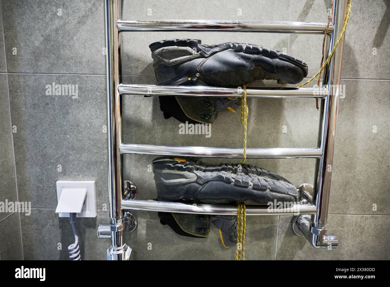 Hiking shoes drying after big camping. Black boots for hiking lying on ...