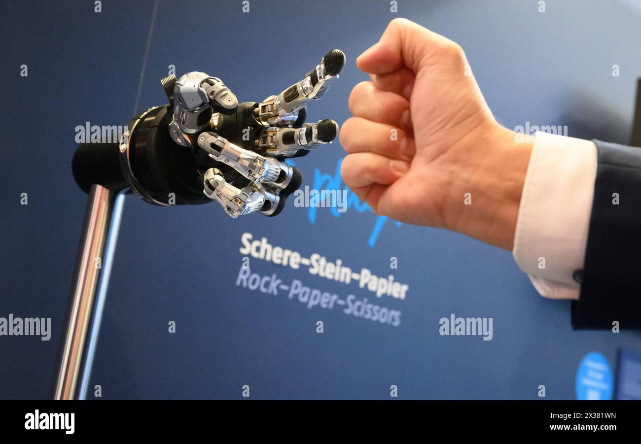 Hanover, Germany. 25th Apr, 2024. A man plays rock-paper-scissors with ...