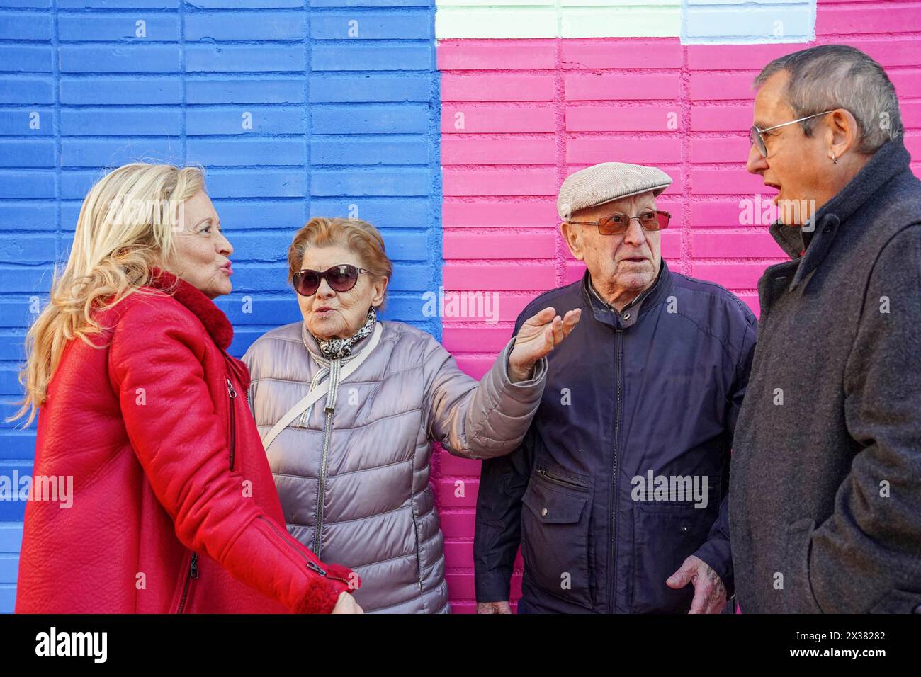 a family talking in front of a colorful wall. communication and love in ...