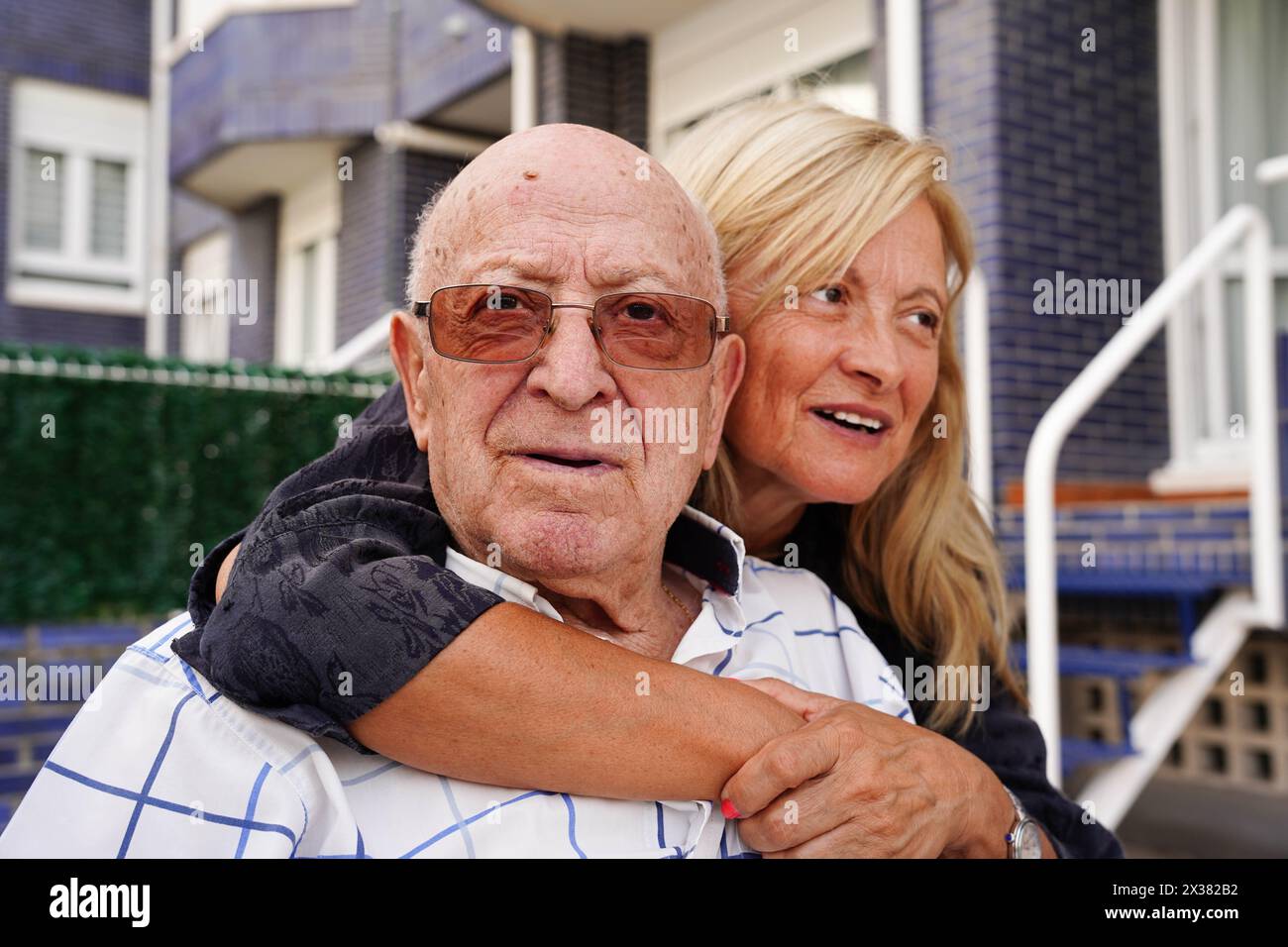 father and daughter hugging on a terrace. Real life Stock Photo - Alamy