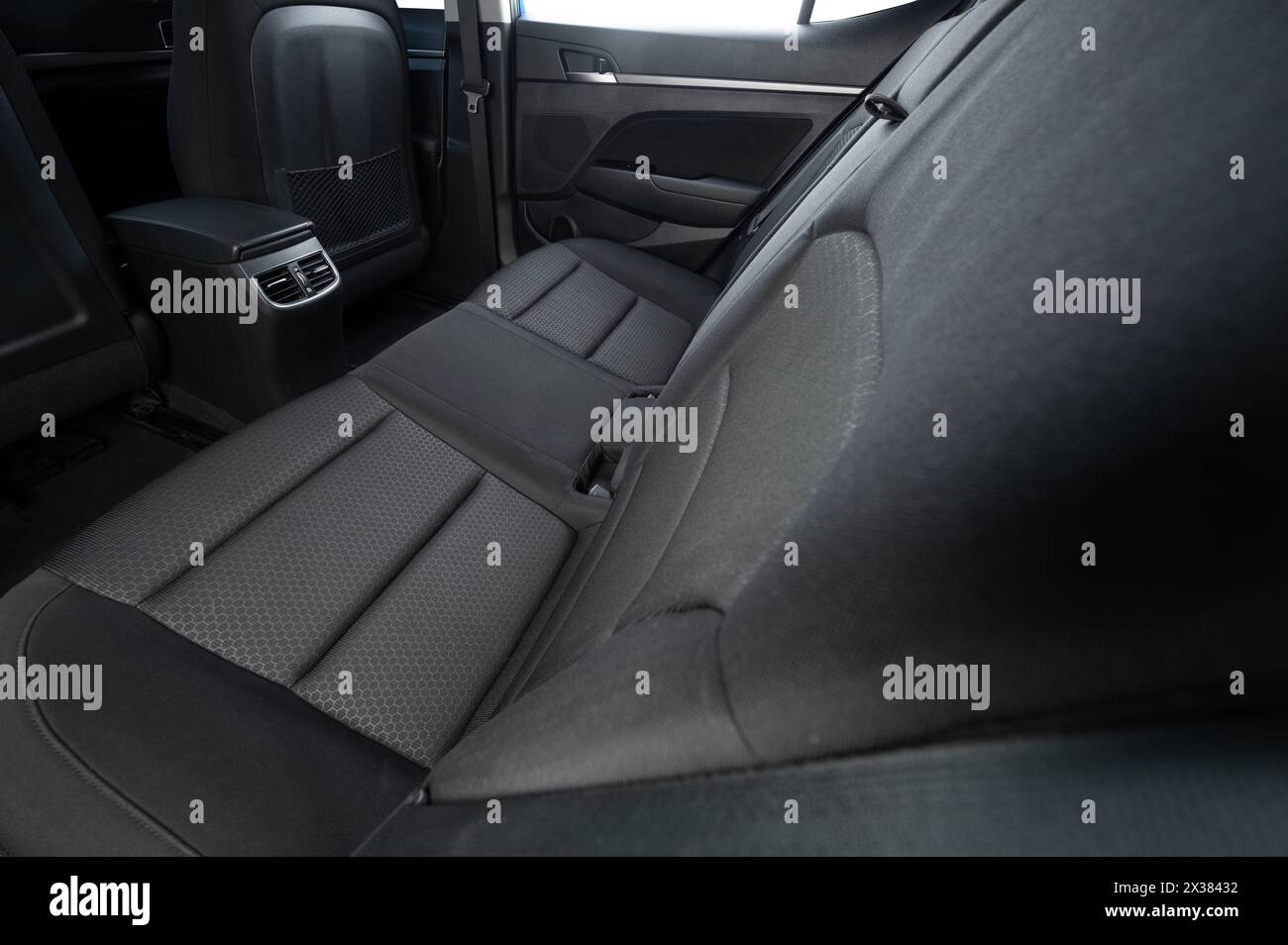 Comfortable sedan car interior with textile seats and back AC vents ...