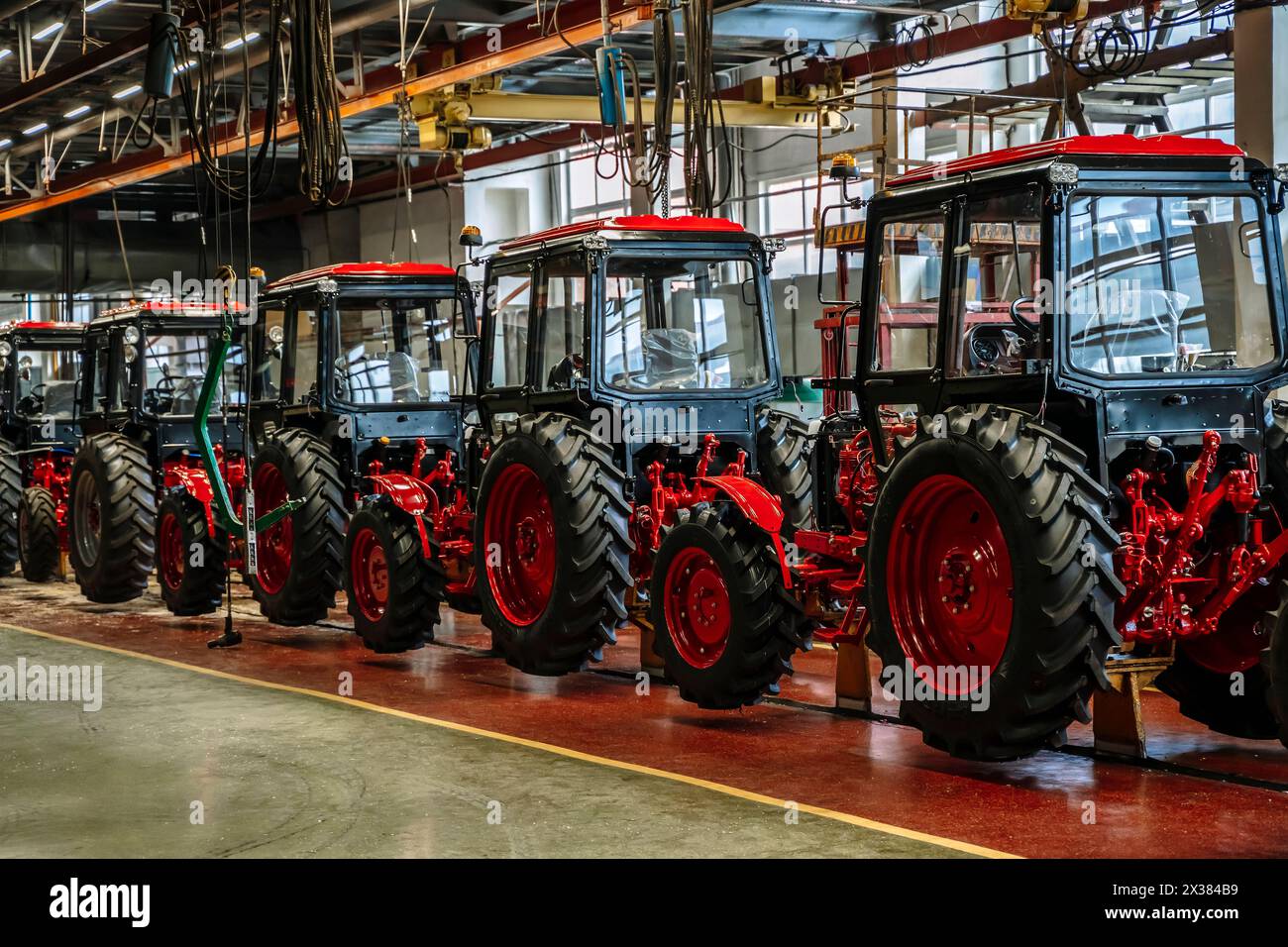 Tractor industry manufacture. New tractors on factory line. Production ...