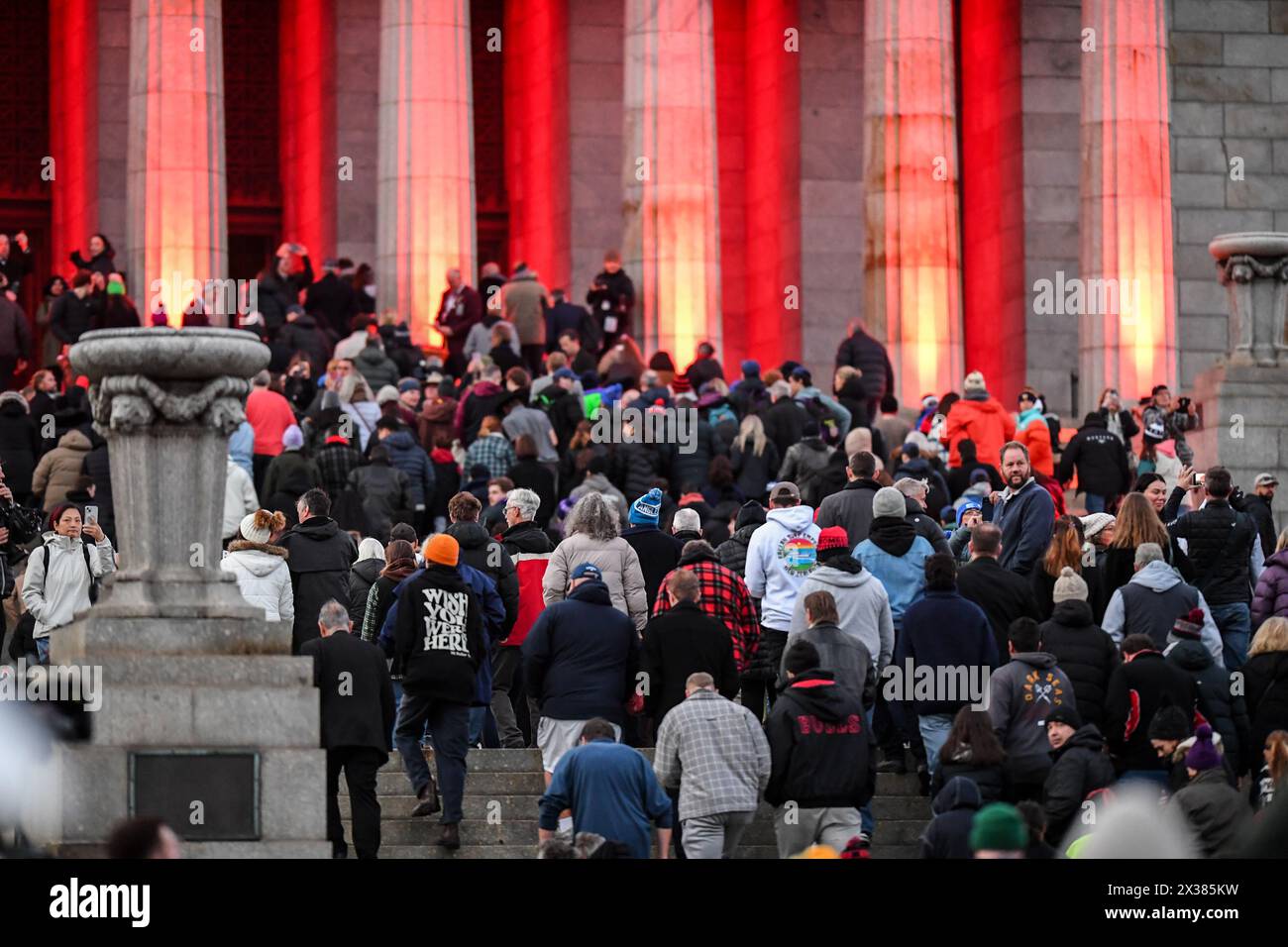 People climb stairs at the Shrine of Remembrance to lay down poppies ...