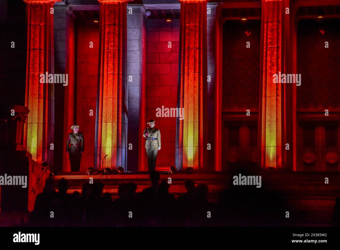 Dawn Service officers are seen to signal the commencement of the ...