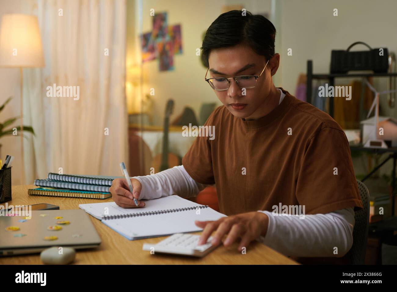 High school student doing math homework Stock Photo - Alamy