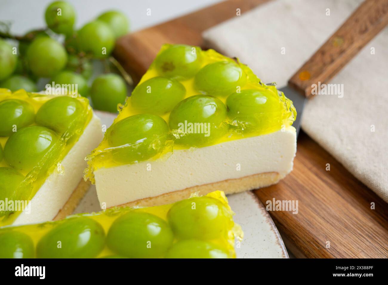 Cheesecake with grapes on a sponge cake base Stock Photo - Alamy