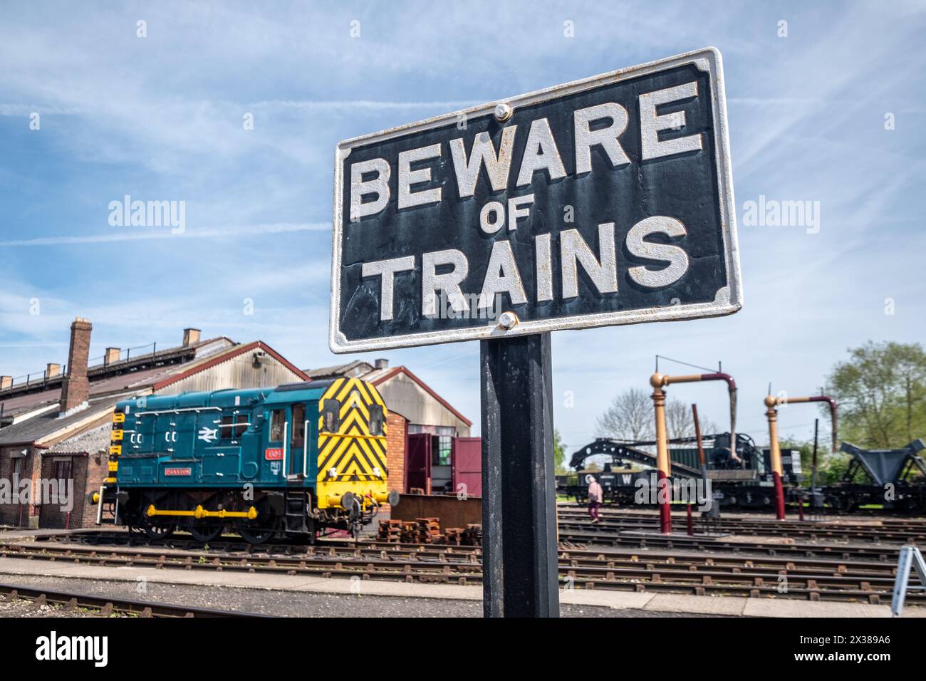 Beware of Trains sign - with a diesel shunter train in the background ...