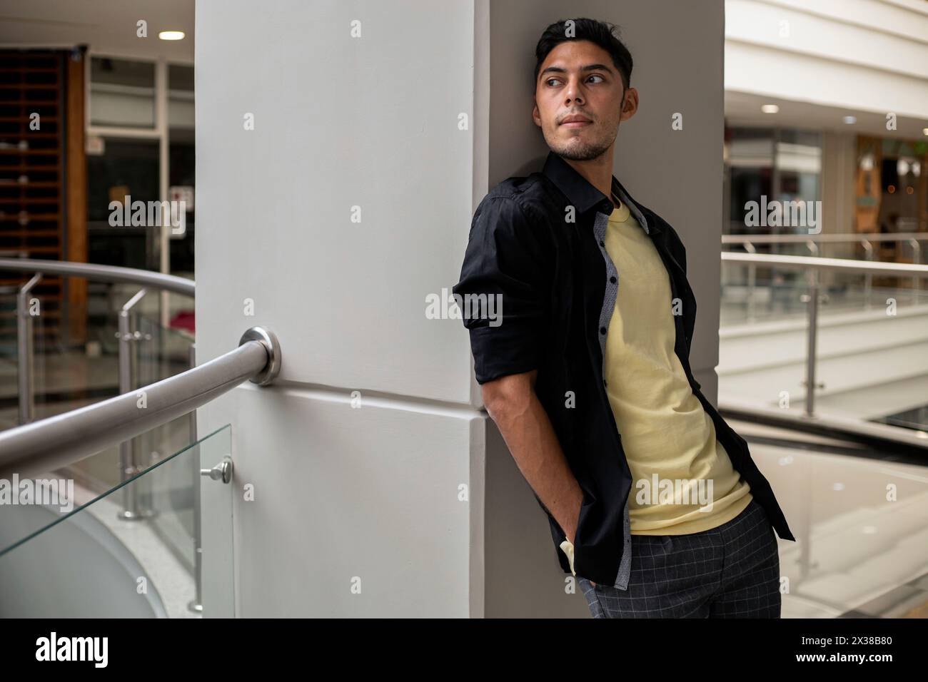 Portrait of Young Latin American Man with relaxed attitude standing and ...