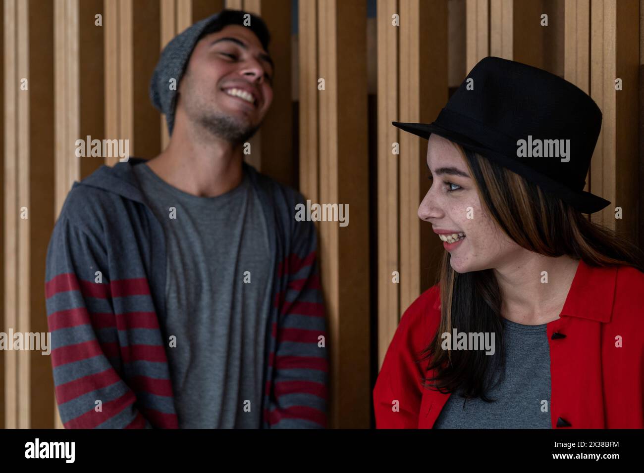 Young Latin American brother and sister couple posing together with ...