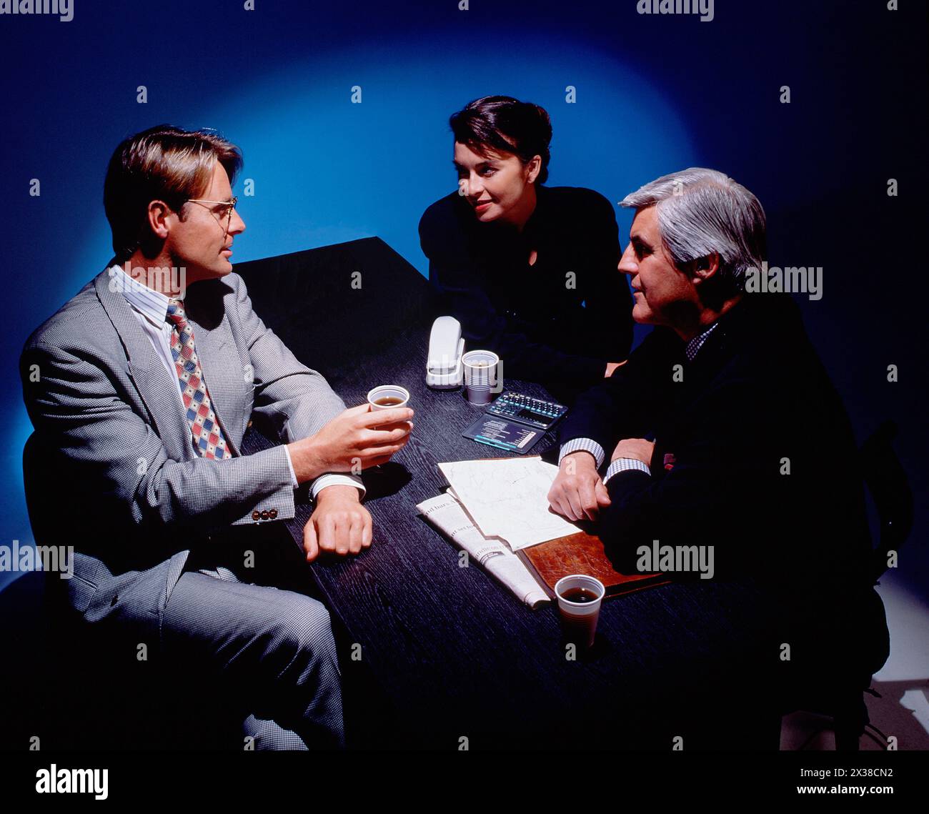 Two men seated at a table hi-res stock photography and images - Alamy