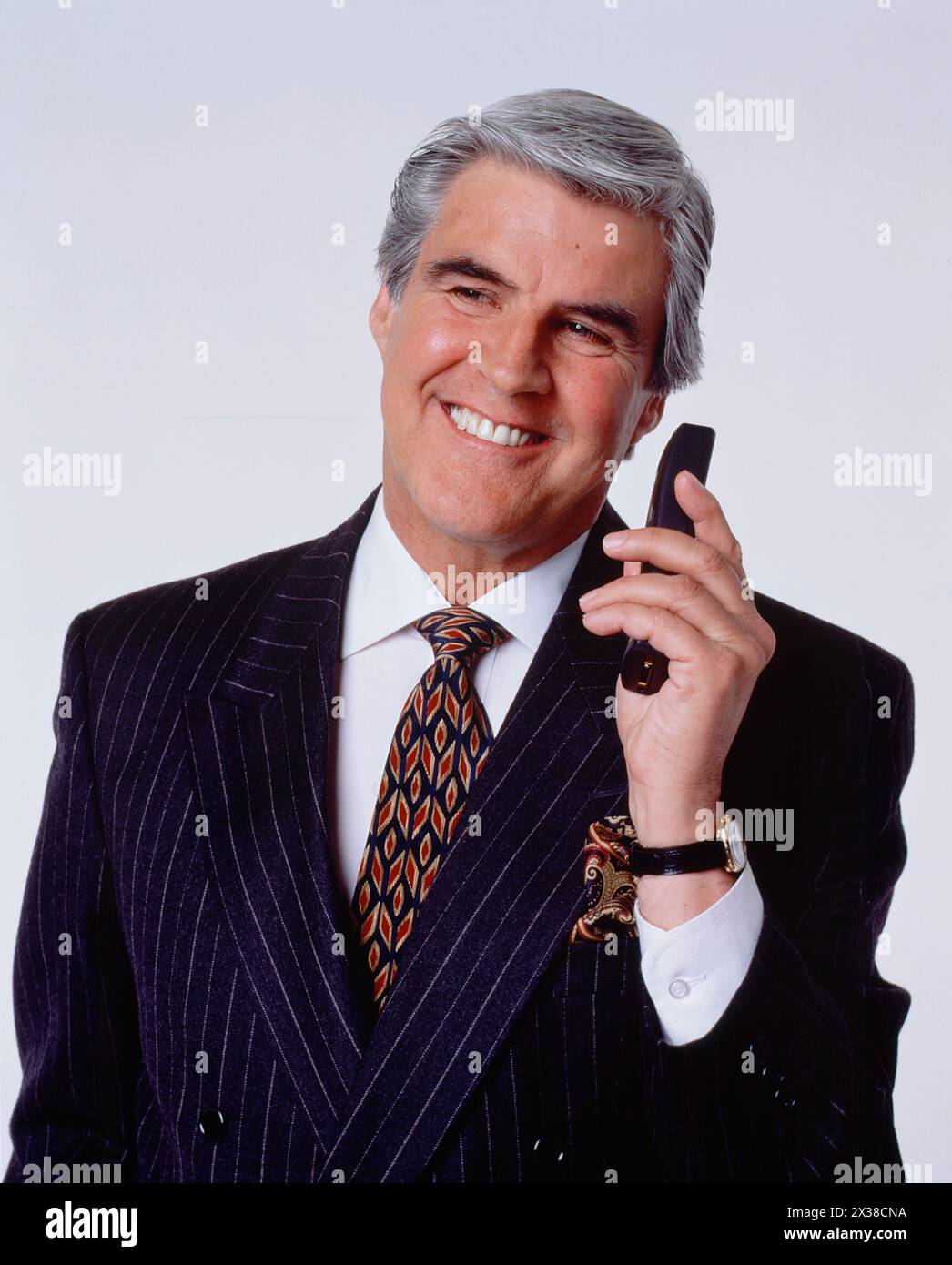 Smiling man using cellphone hi-res stock photography and images - Alamy