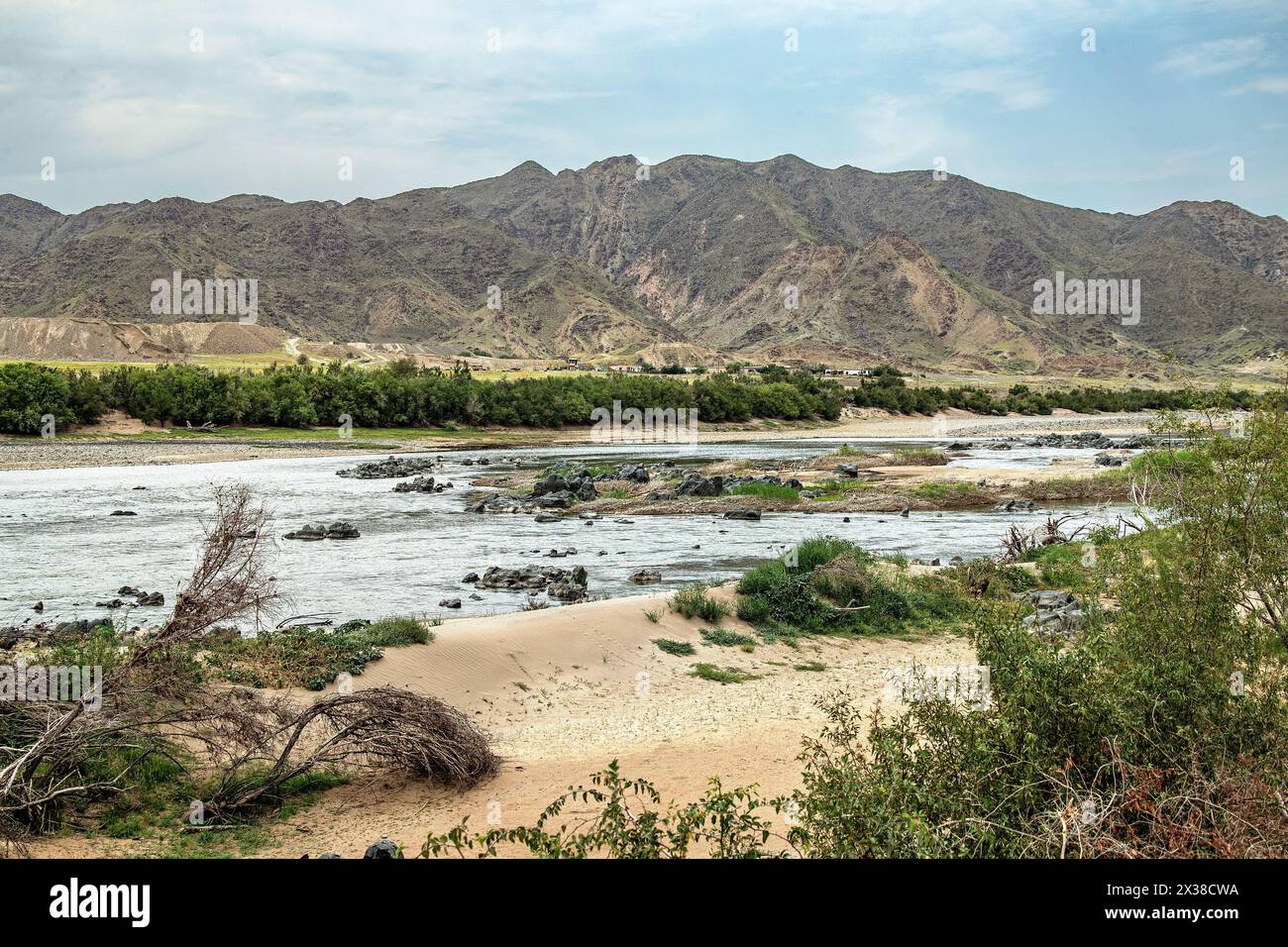 Low water revealing rocks and islands in the Orange in Namibia with ...