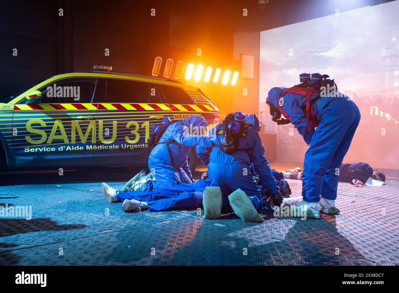 Seriously injured people receive treatment from first aiders and ...