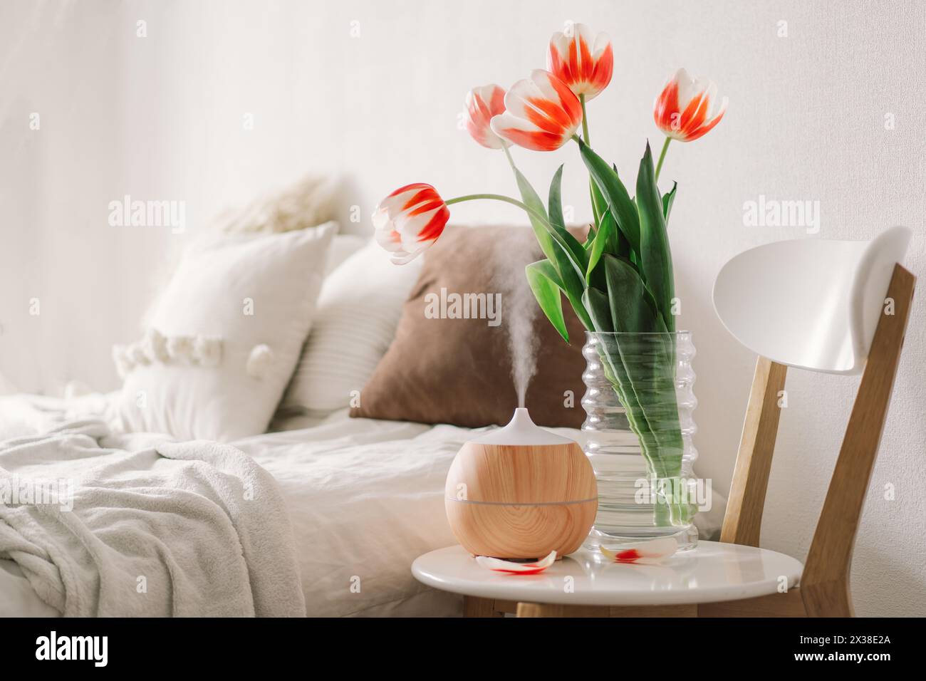 Aromatherapy Concept. Aroma oil diffuser on chair against in the ...
