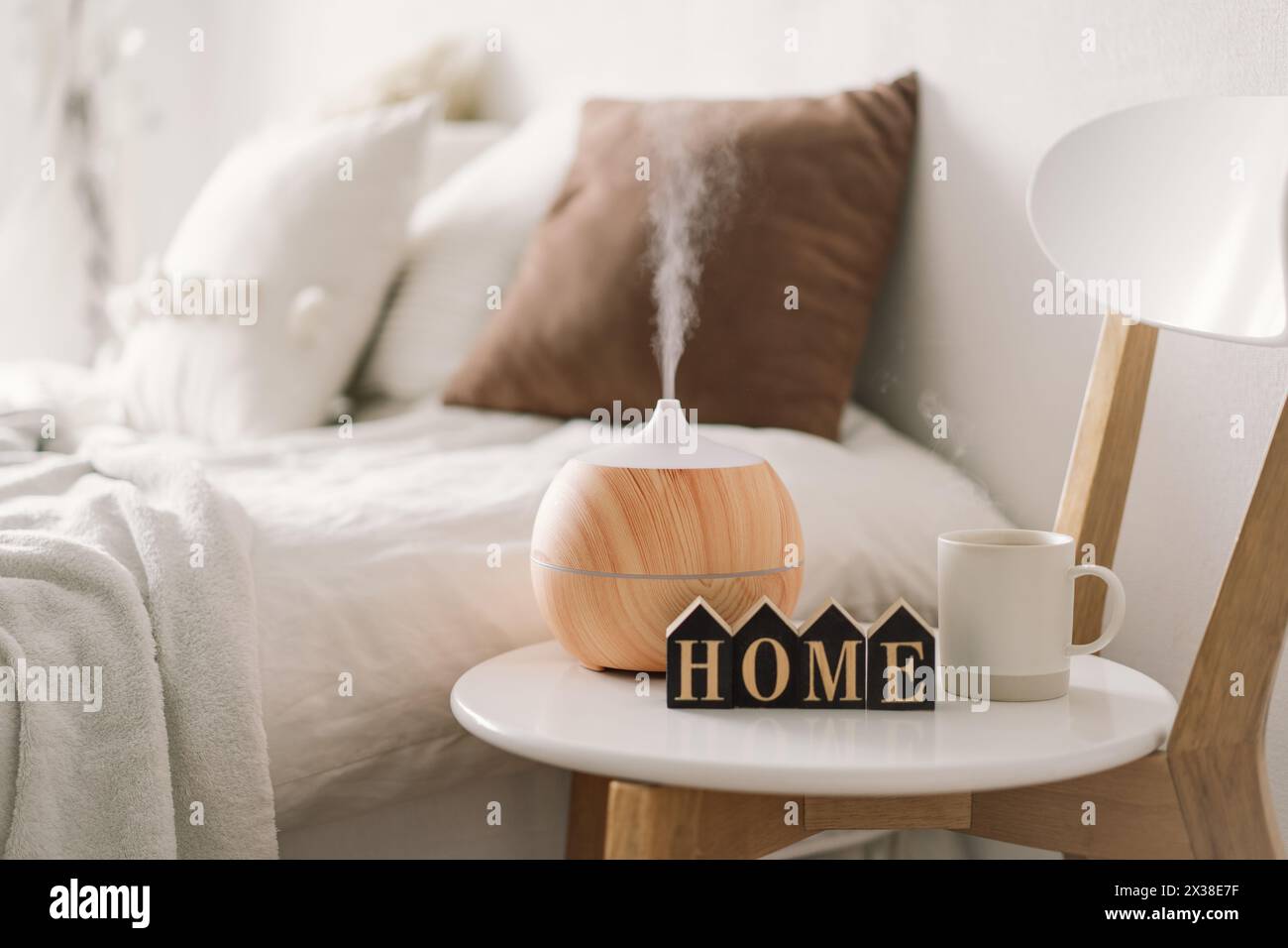 Aromatherapy Concept. Aroma oil diffuser on chair against in the ...