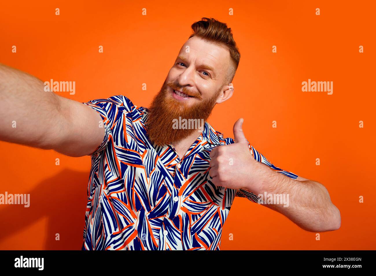Photo of good mood confident guy dressed print shirt tacking selfie ...