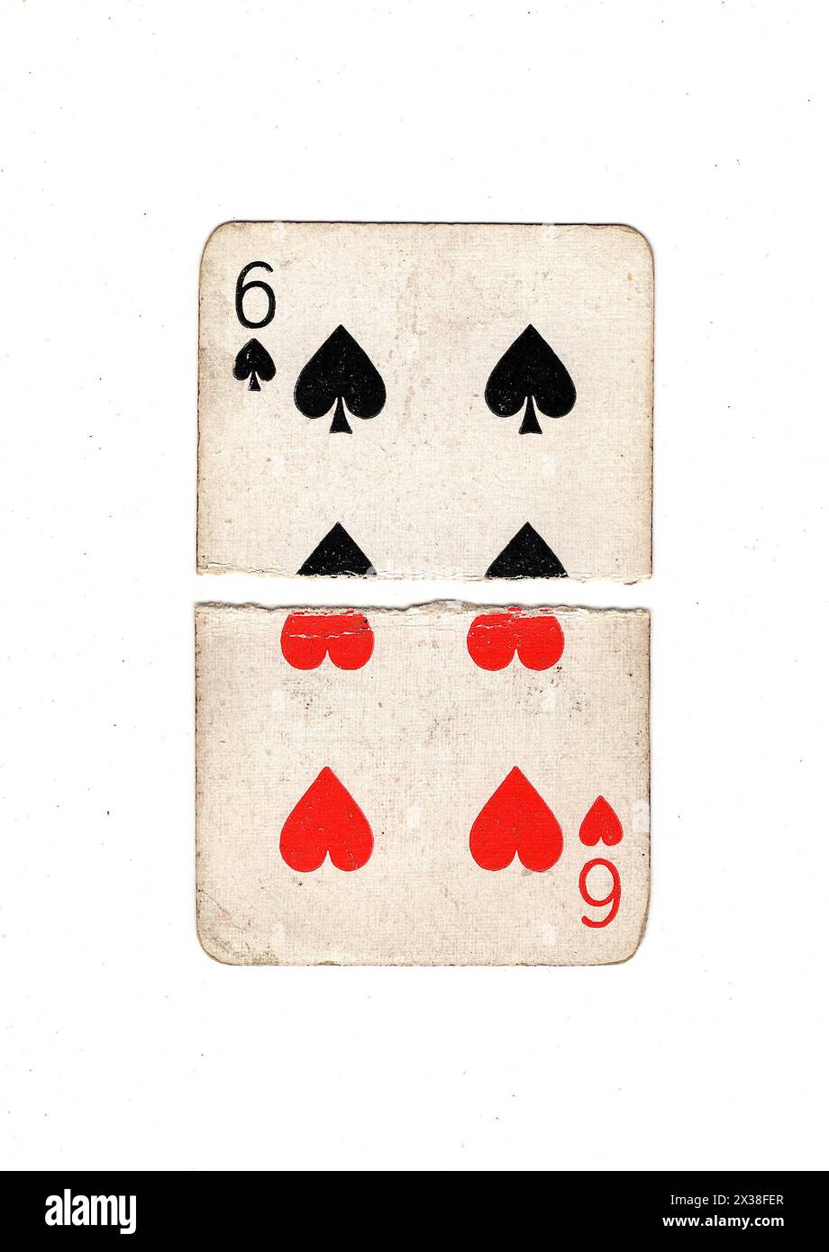 A vintage six playing card made up of different suits in torn halves ...