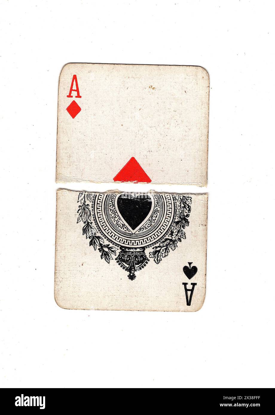 A vintage ace playing card made up of different suits in torn halves ...