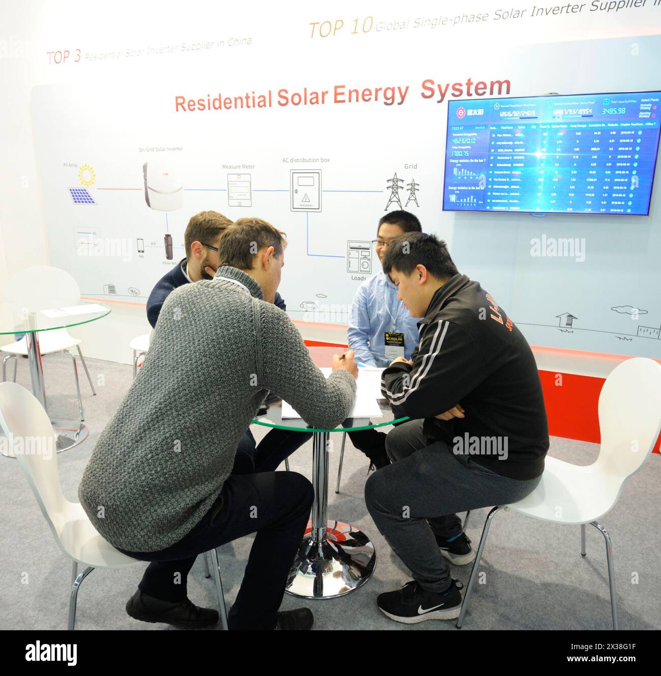 Engaging in dialogue. Asian businessmen sitting at the table at the ...