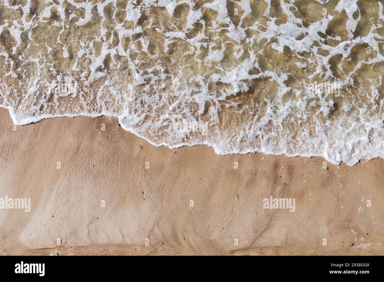 Sea shore with sand and foam, top view. Natural aerial background photo ...