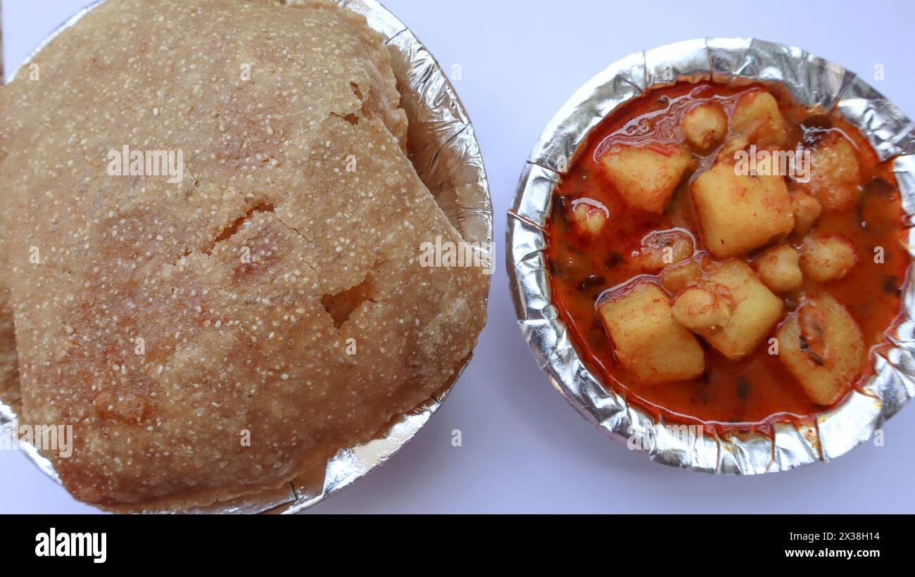 Tasty Bedmi Puri with Aloo ki sabzi served in bowl. Breakfast item from ...