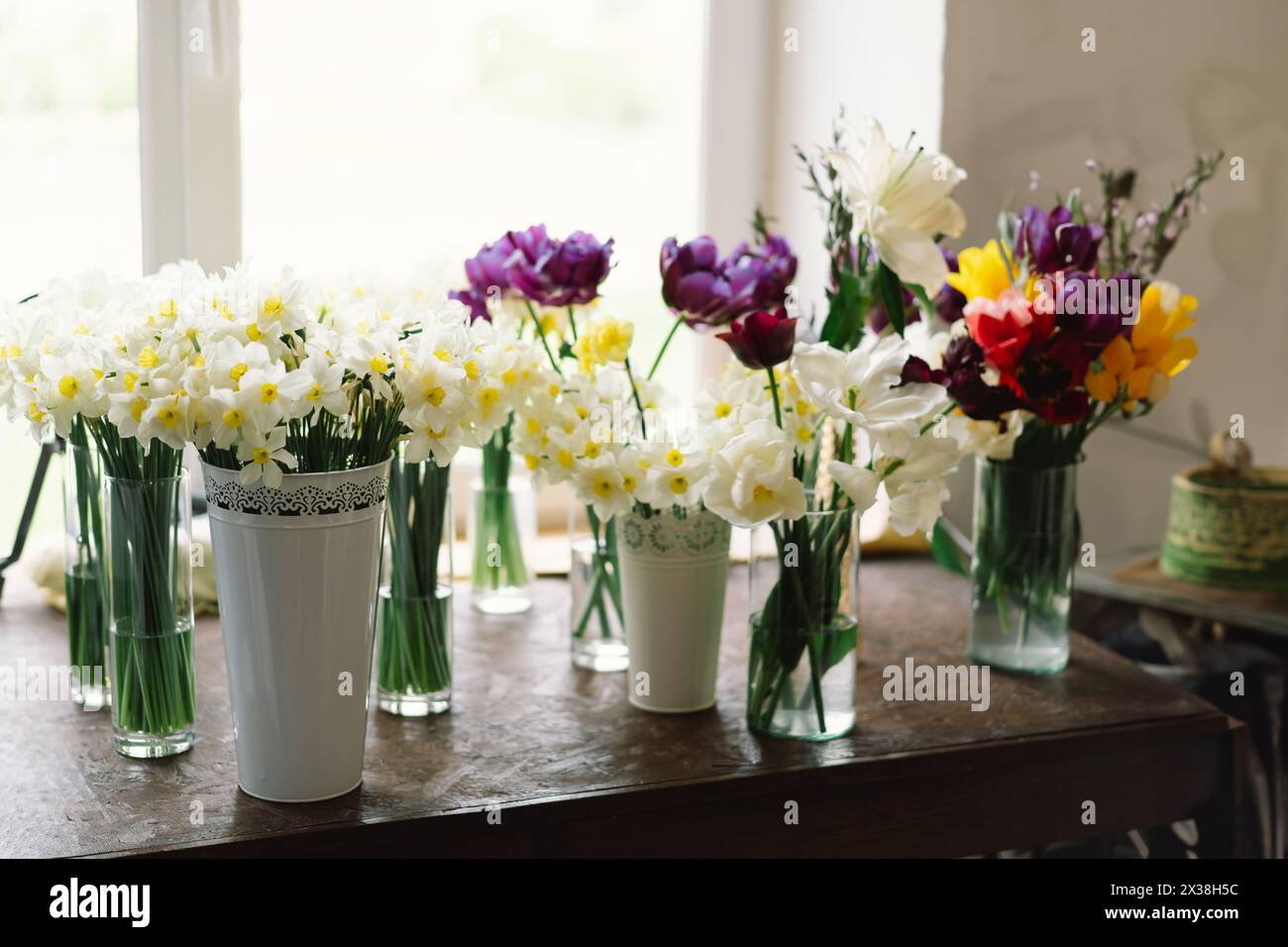 Collection of beautiful fresh flowers in stylish vases Stock Photo - Alamy