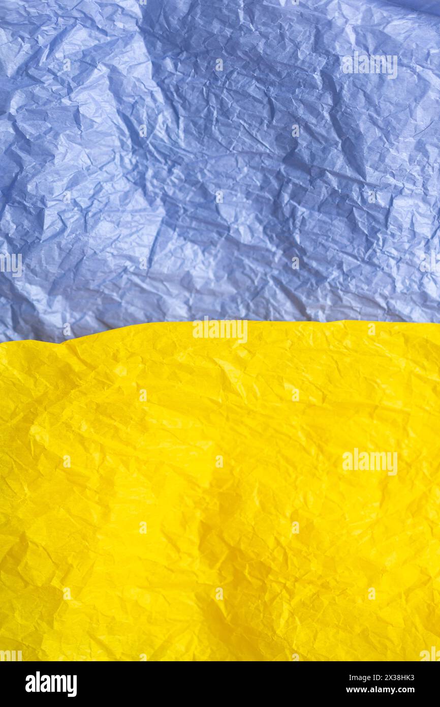 Paper in blue and yellow colors of the flag of Ukraine, UA. Blue and ...