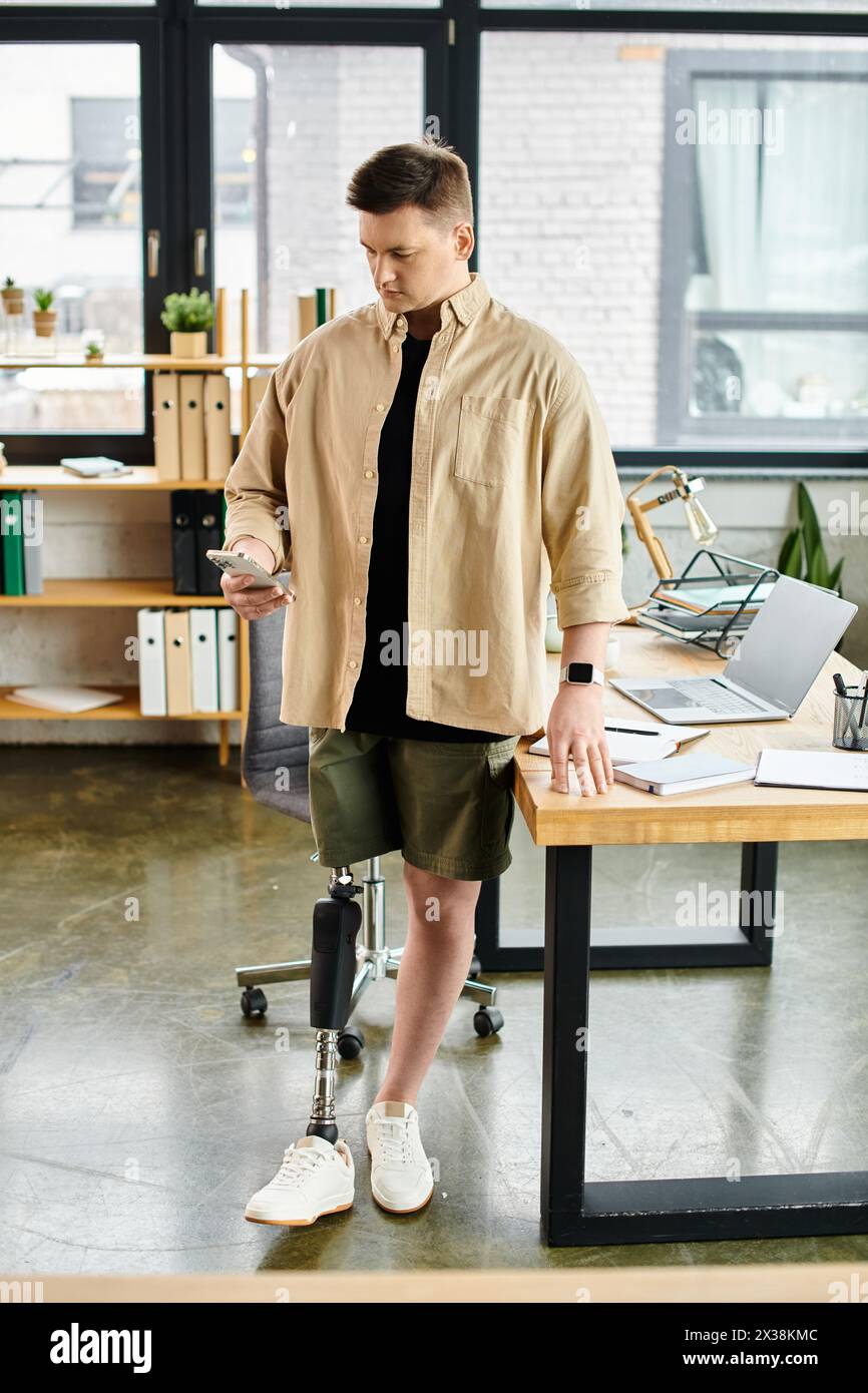 A handsome businessman with a prosthetic leg stands at a desk in a ...
